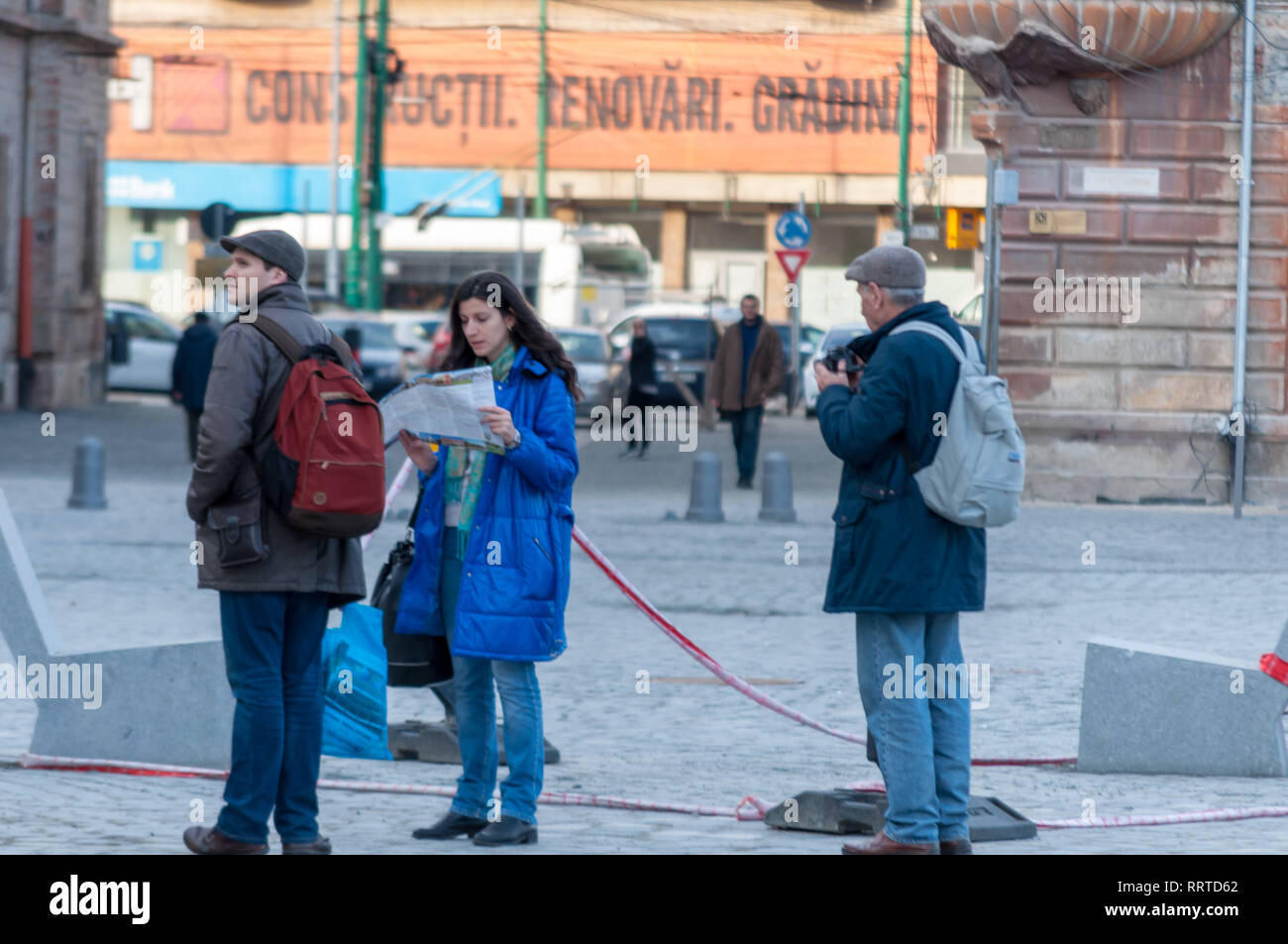 TIMISOARA, ROMANIA - FEBRUARY 09, 2016: Tourists loking at a map ...