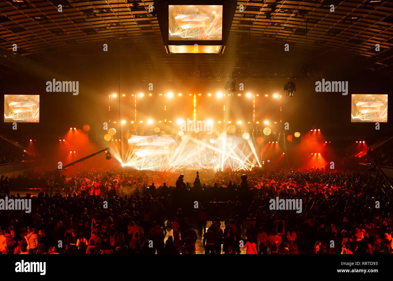 Concert crowd having fun at a rock concert. Large concert hall with a ...