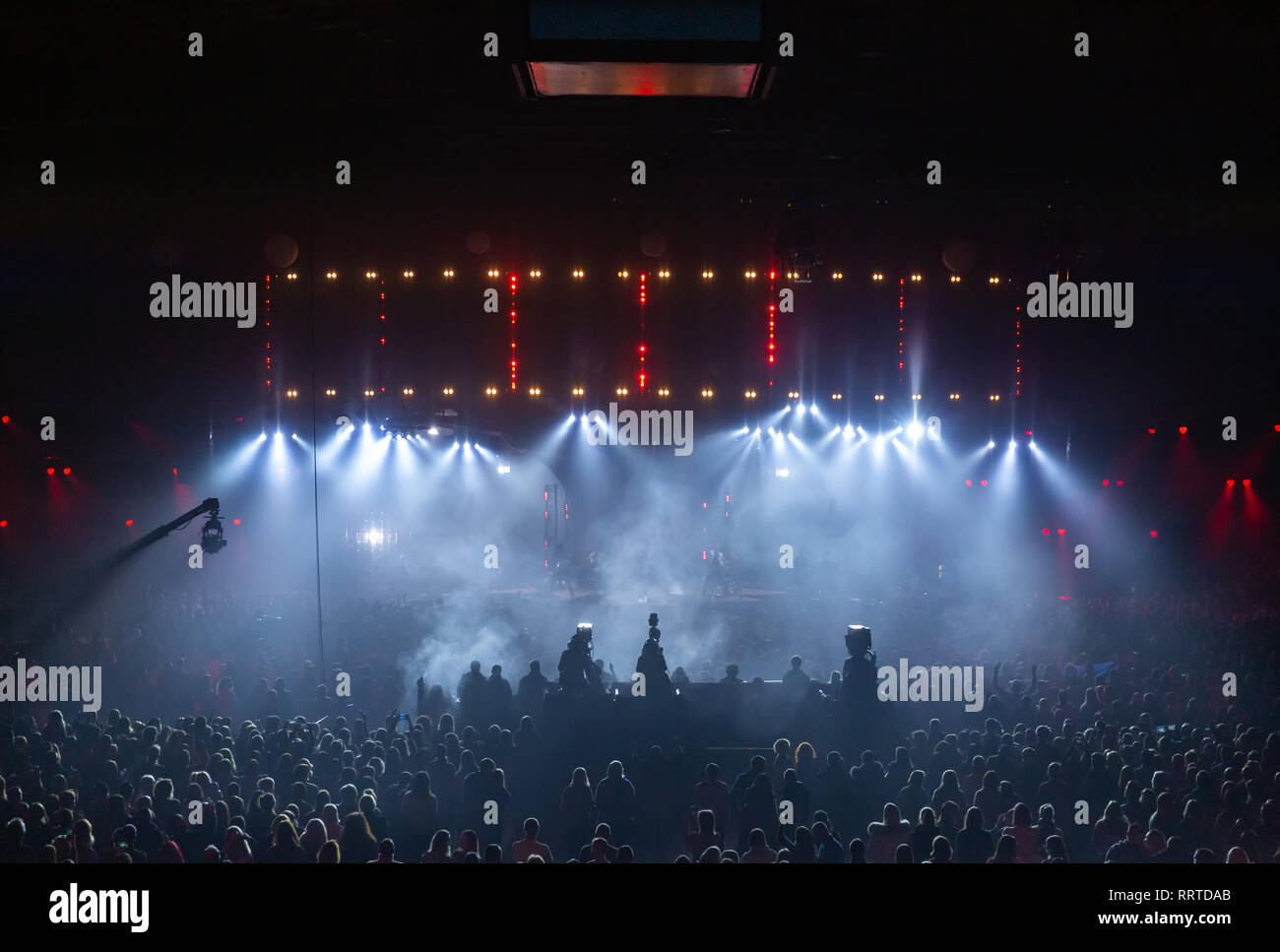 Scene illuminated by beautiful rays of lighting equipment. The concert ...