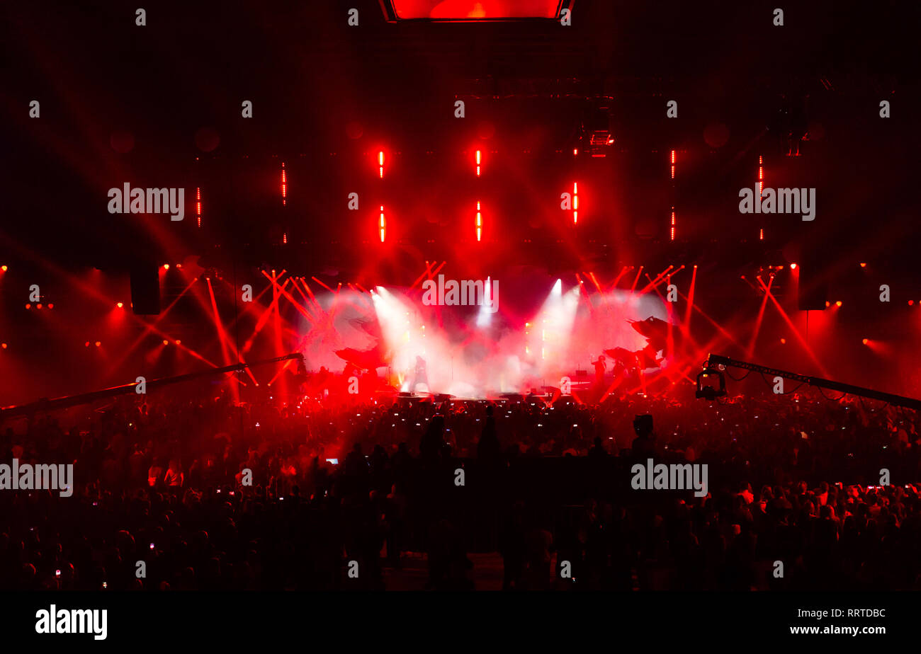 Concert crowd having fun at a rock concert. Large concert hall with a ...