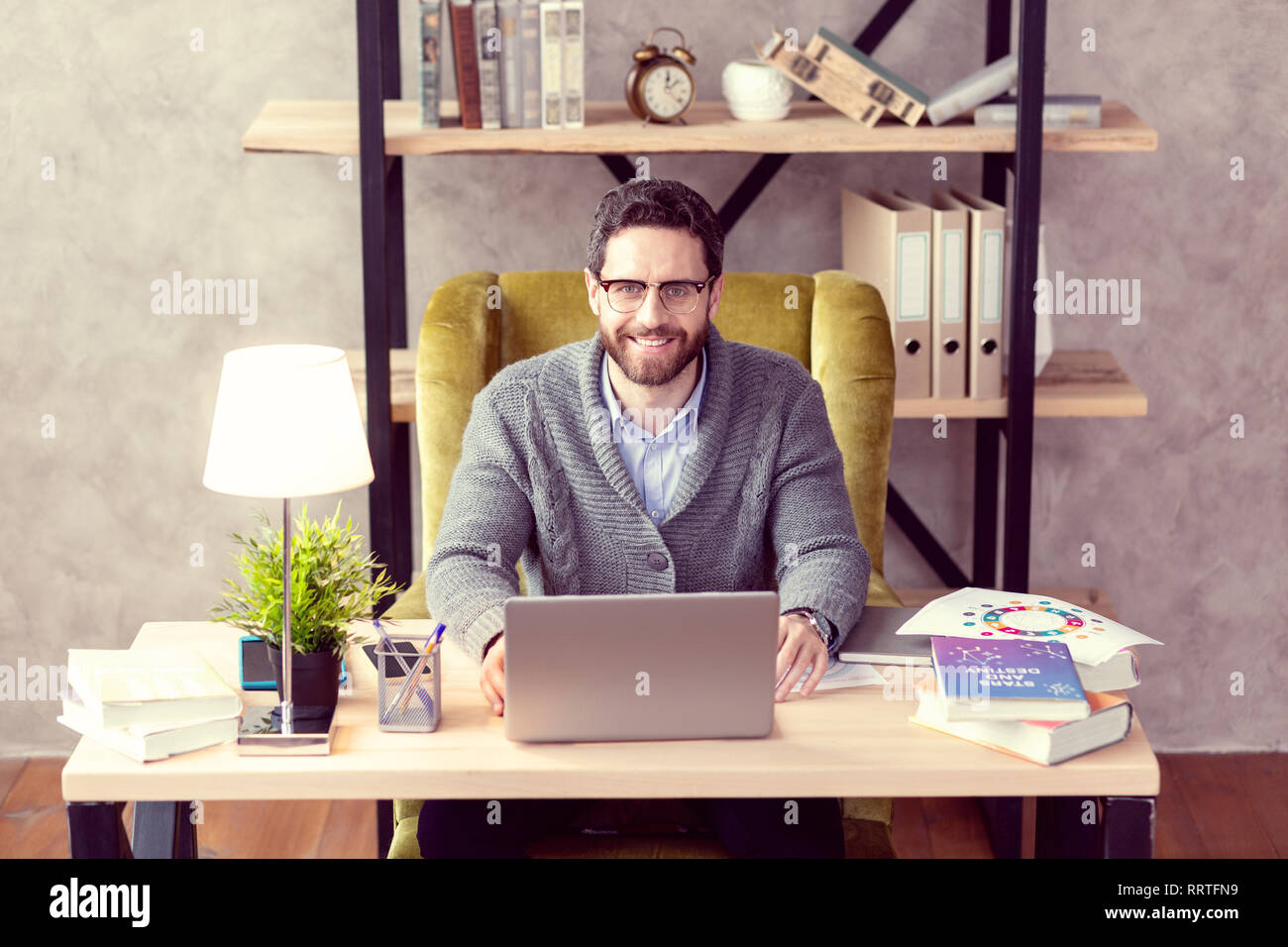 Joyful cheerful nice man enjoying his job Stock Photo - Alamy