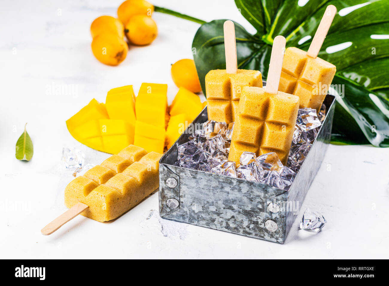 Tropical mango popsicles Stock Photo - Alamy