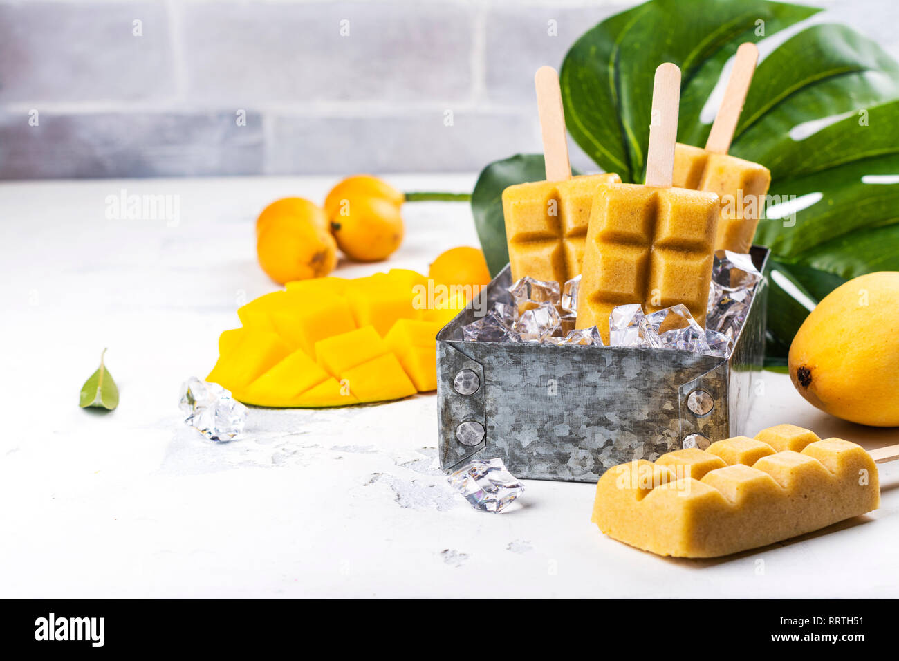Tropical mango popsicles Stock Photo - Alamy