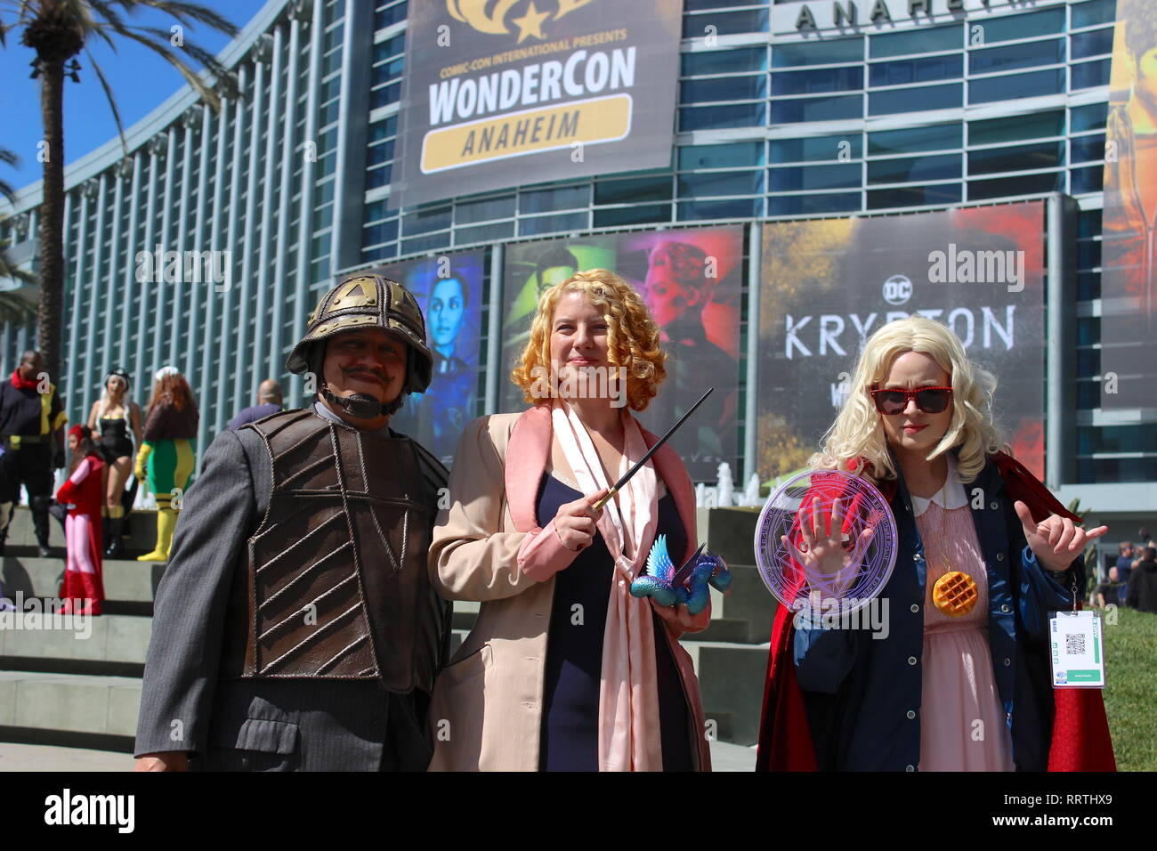 Wondercon attendees pose in their cosplay outfits in front of the ...