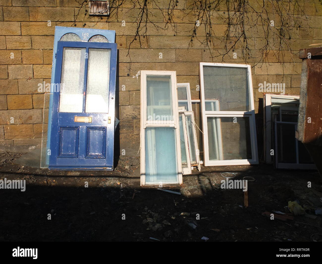 A selection of salvaged doors and windows at a reclamation yard ...