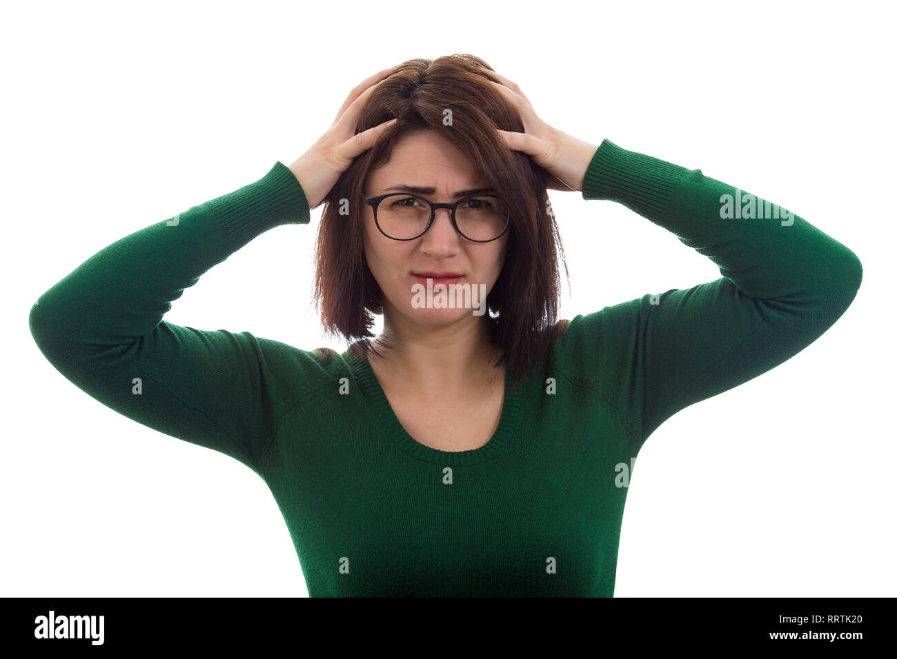 Desperate young woman holding hands in hair throwing a tantrum, having ...