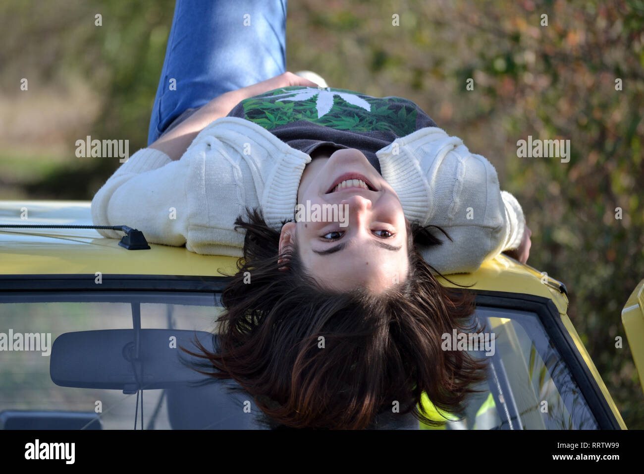 Girl on car roof hi-res stock photography and images - Alamy