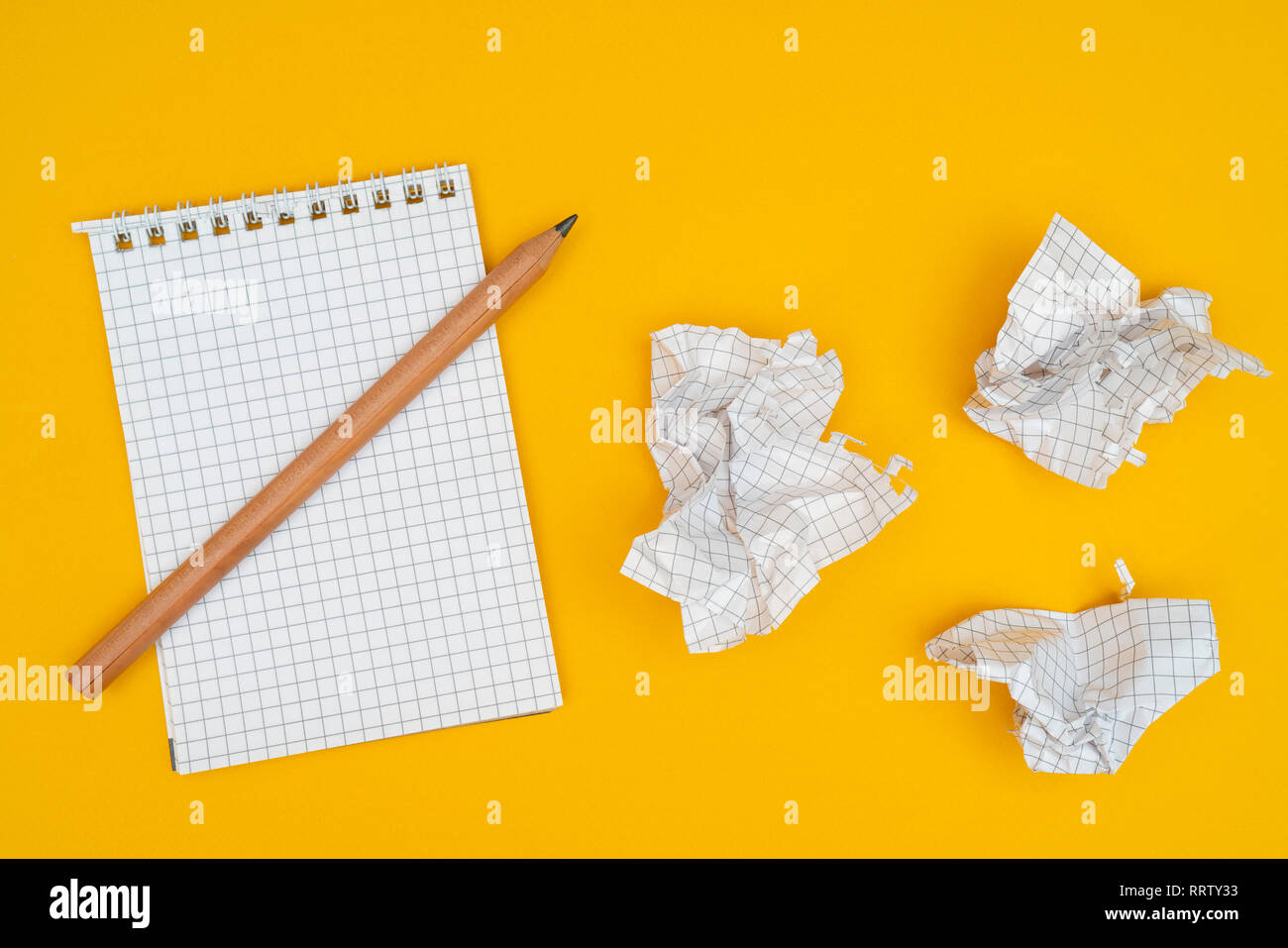 Pencil, notebook and crumpled sheets of paper Stock Photo - Alamy