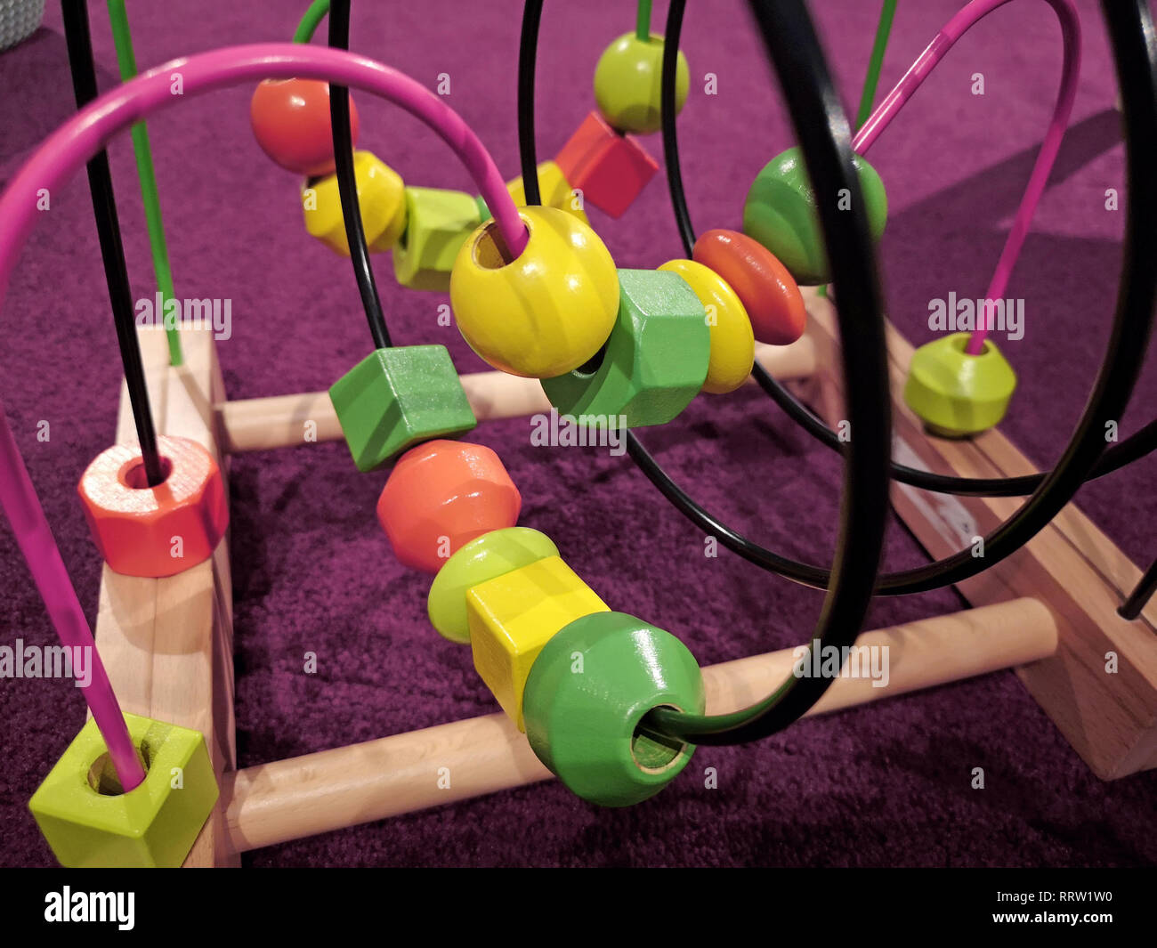 Children's educational toys labyrinth on bed room Stock Photo - Alamy