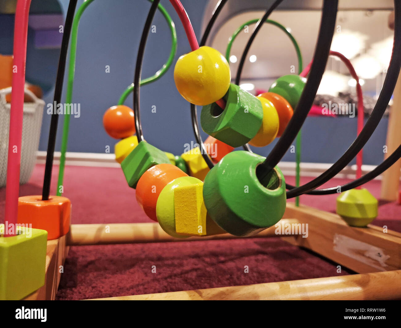 Children's educational toys labyrinth on bed room Stock Photo - Alamy
