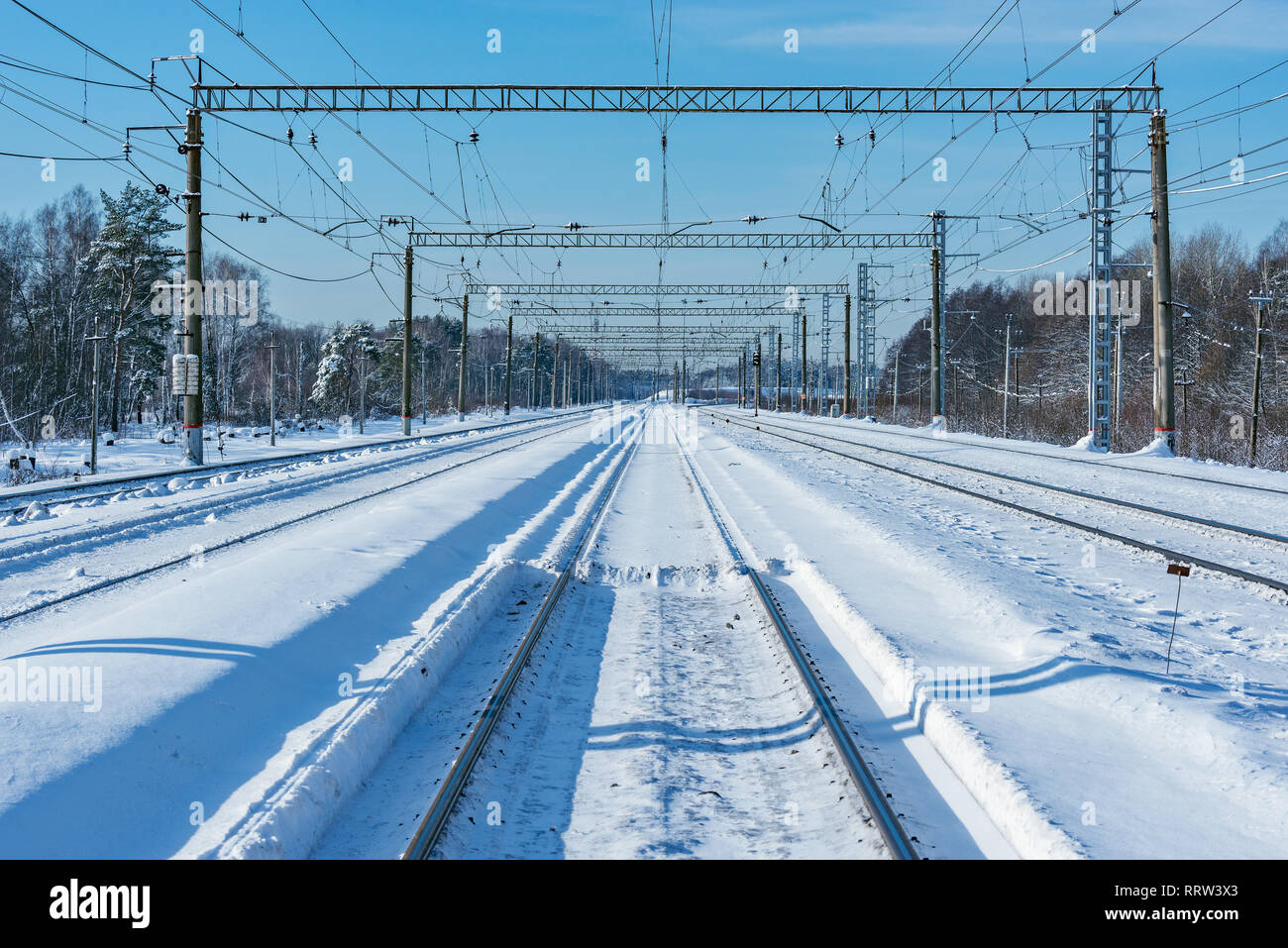 Electric railway lines at winter day time Stock Photo - Alamy