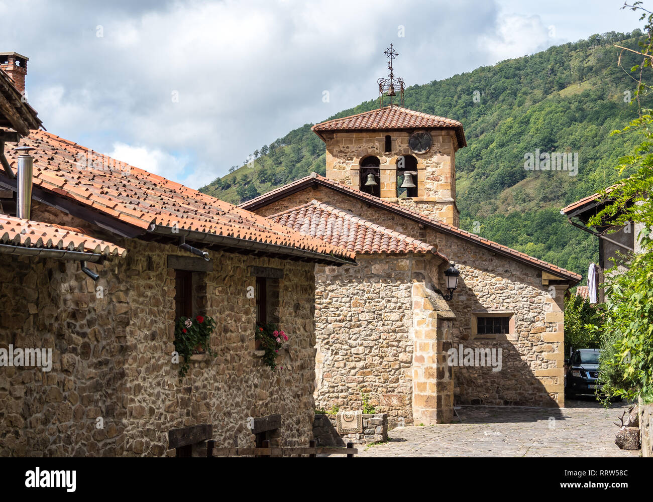 Barcena Mayor, Cabuerniga valley, with typical stone houses is one of ...