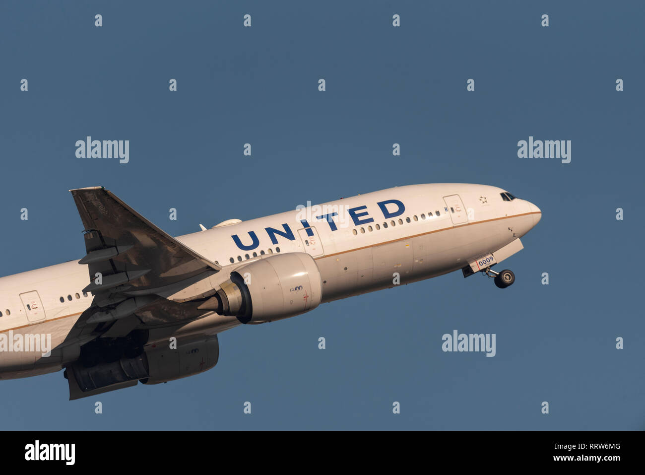 United Airlines Boeing 777 jet airliner plane N78009 taking off from ...