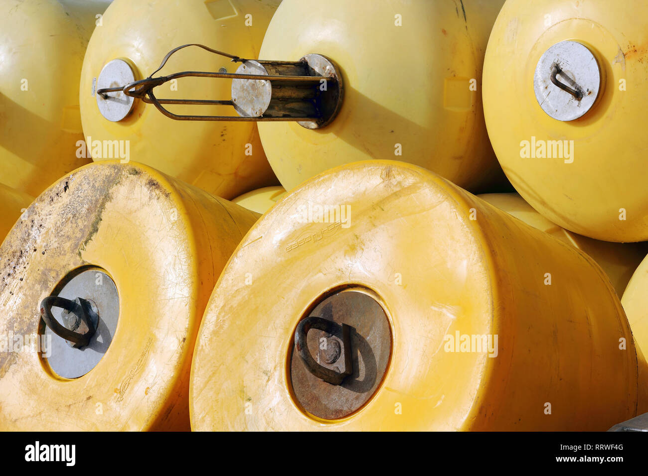 Stack of yellow buoys in a port Stock Photo - Alamy