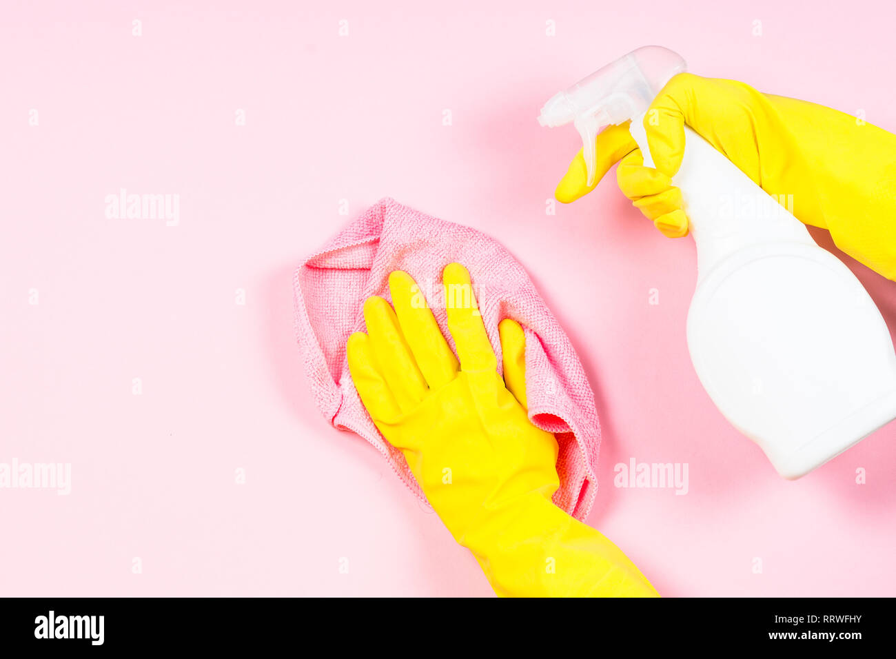 Woman cleaning pink surface Stock Photo - Alamy