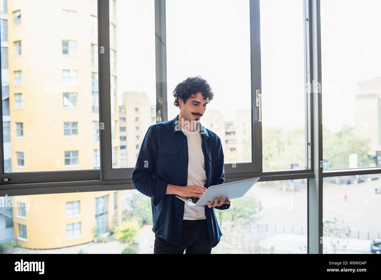 Worker standing watching hi-res stock photography and images - Alamy