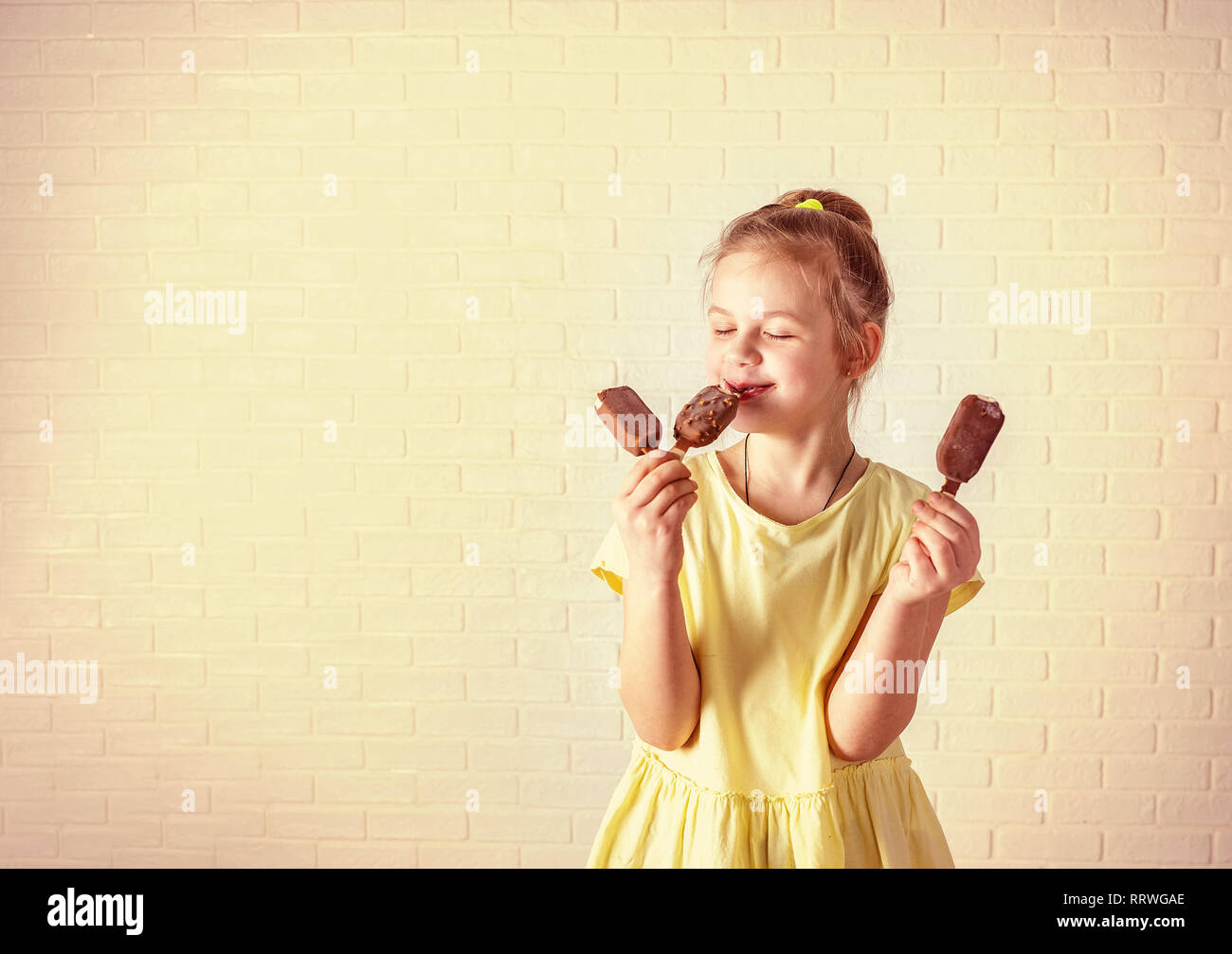 happy little girl eating popsicle at summer time, copy space Stock ...