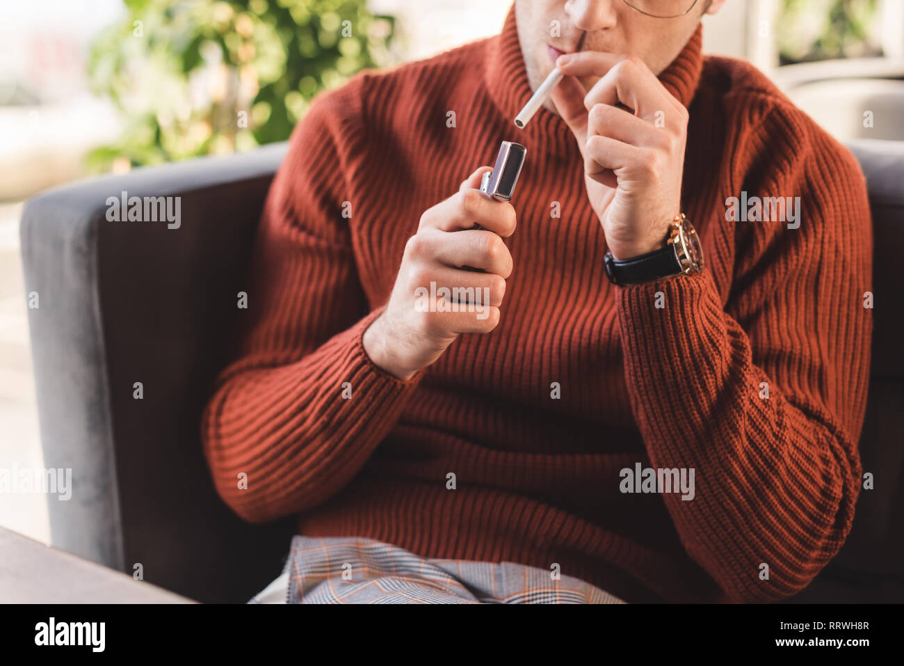 Man smoking cigarette in cafe hi-res stock photography and images - Alamy