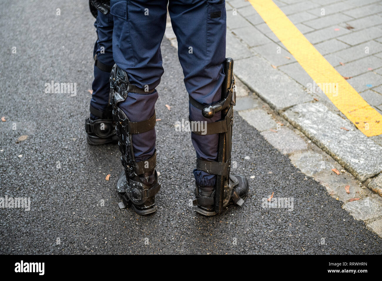 Police baton on right feet of a French police officer at Yellow jackets ...