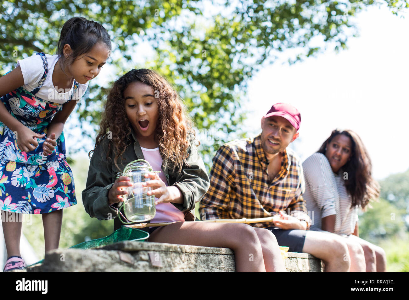 Woman catching a fish hi-res stock photography and images - Alamy