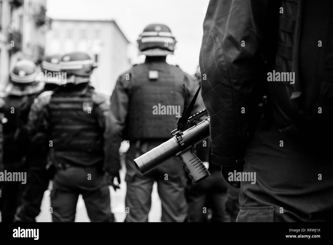 French Police officers securing the zone in front of the yellow vests ...