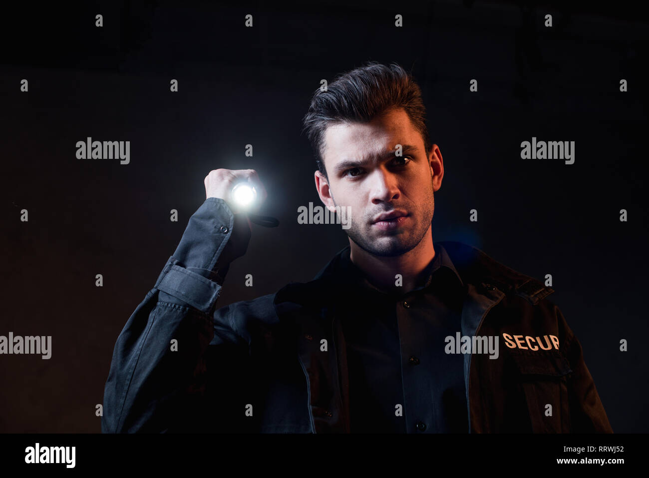 Male security guard flashlight hi-res stock photography and images - Alamy