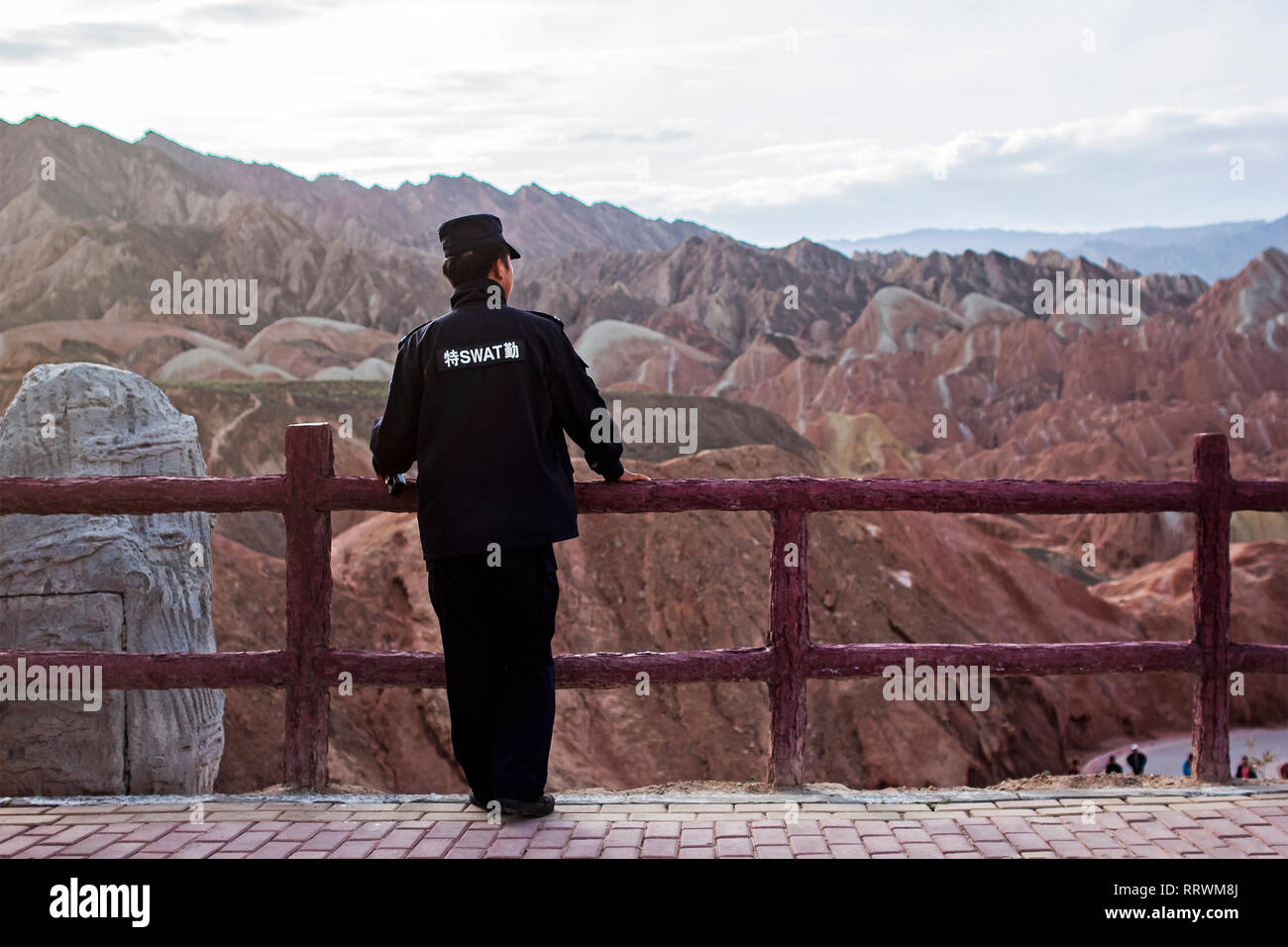 A Chinese Security Guard Is Viewing Landscape. SWAT Is On Duty Keeping ...