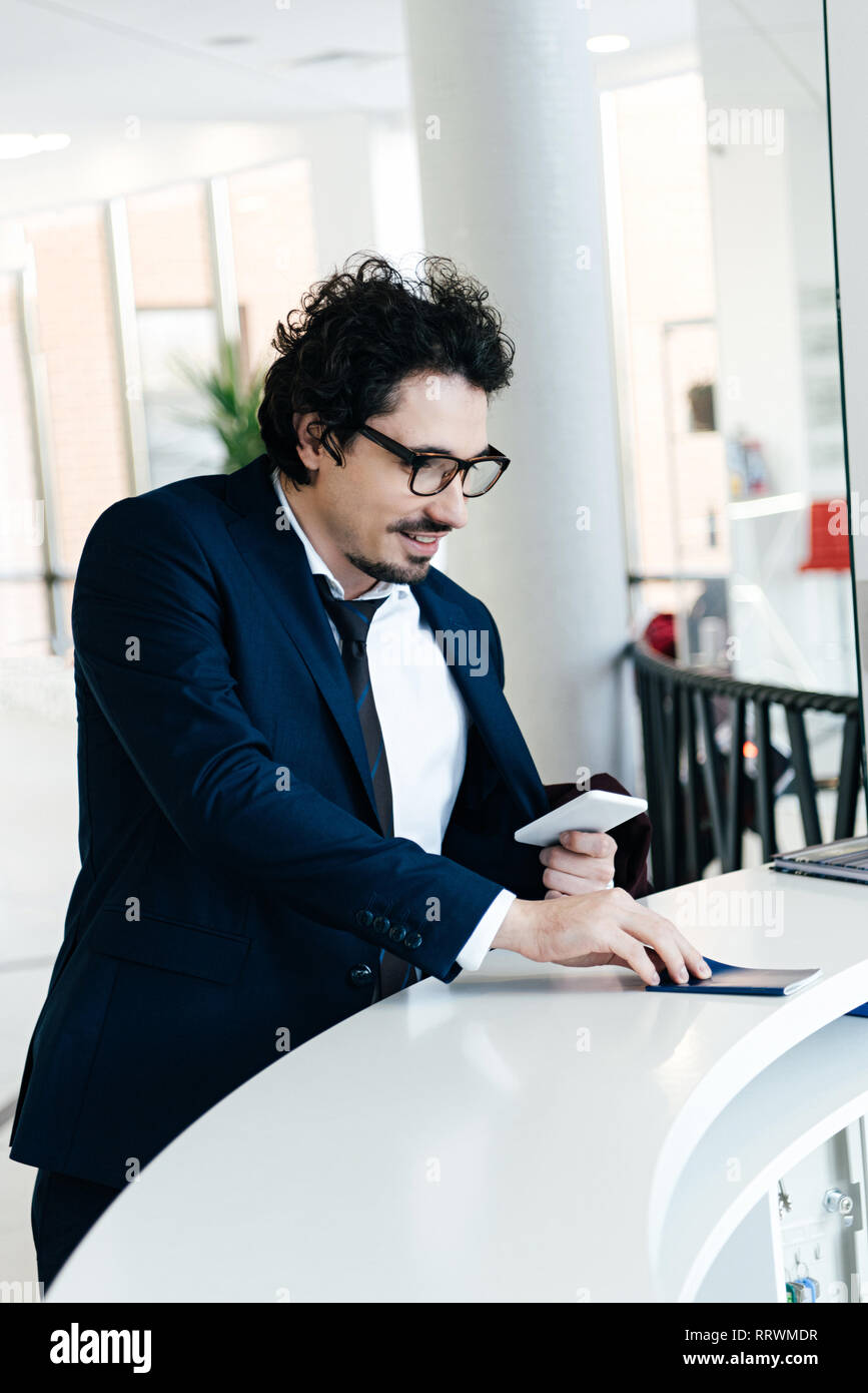 Passport hotel check in hi-res stock photography and images - Alamy