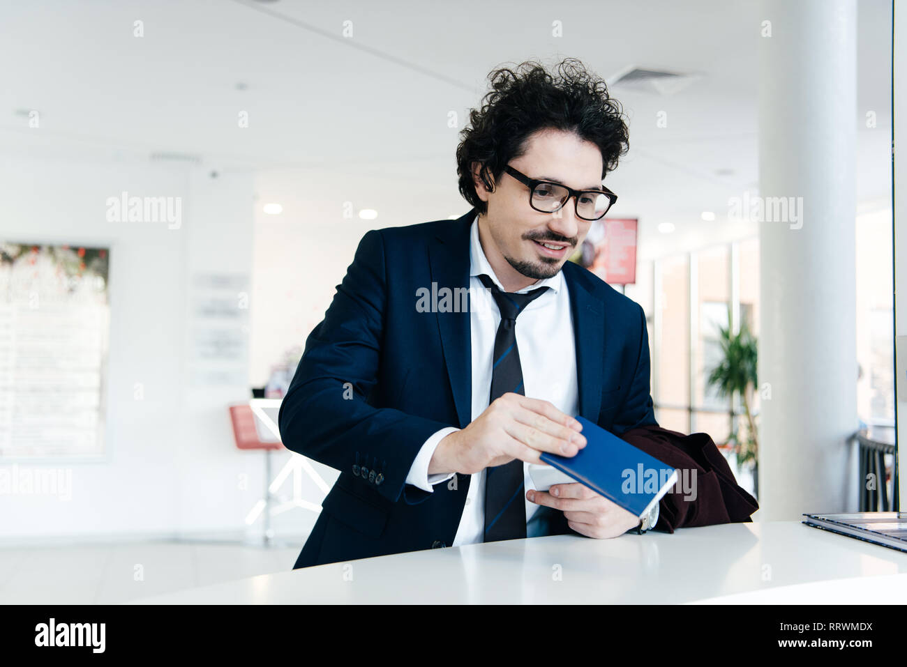 Passport hotel check in hi-res stock photography and images - Alamy