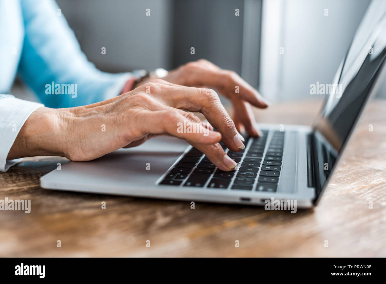 Hands on elderly woman typing hi-res stock photography and images - Alamy