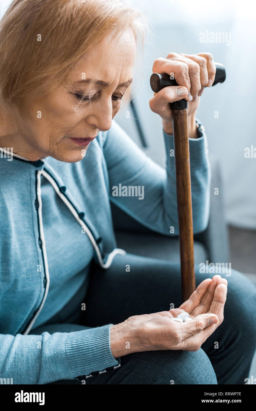 Senior woman walking stick hi-res stock photography and images - Alamy