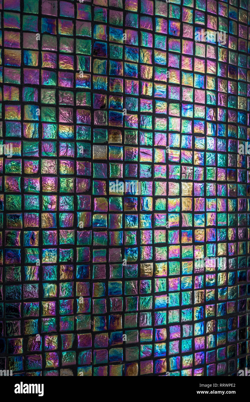 Iridescent tiled column with black grout Stock Photo - Alamy
