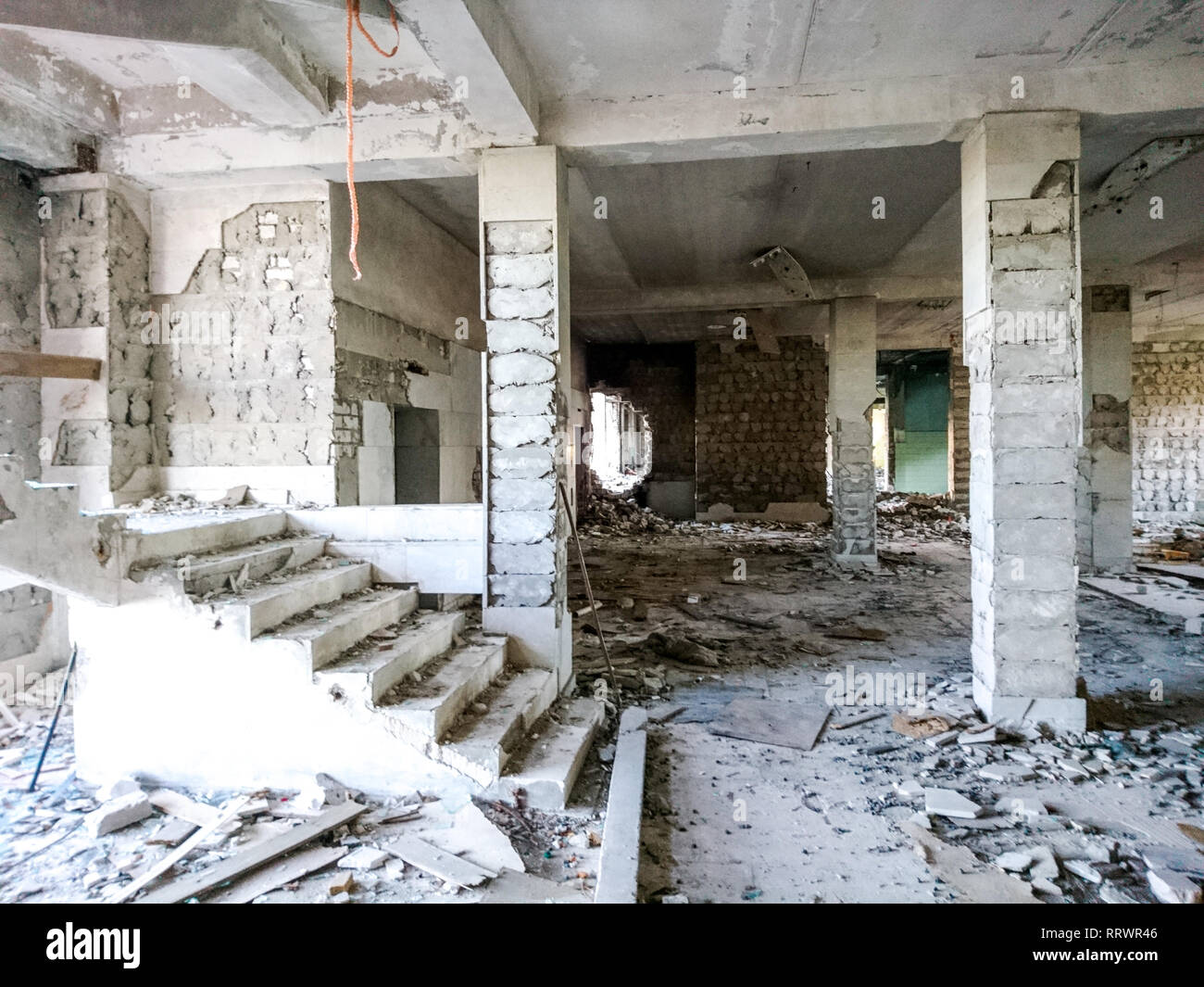 The ruins of a large destroyed building, pieces of stone, concrete ...