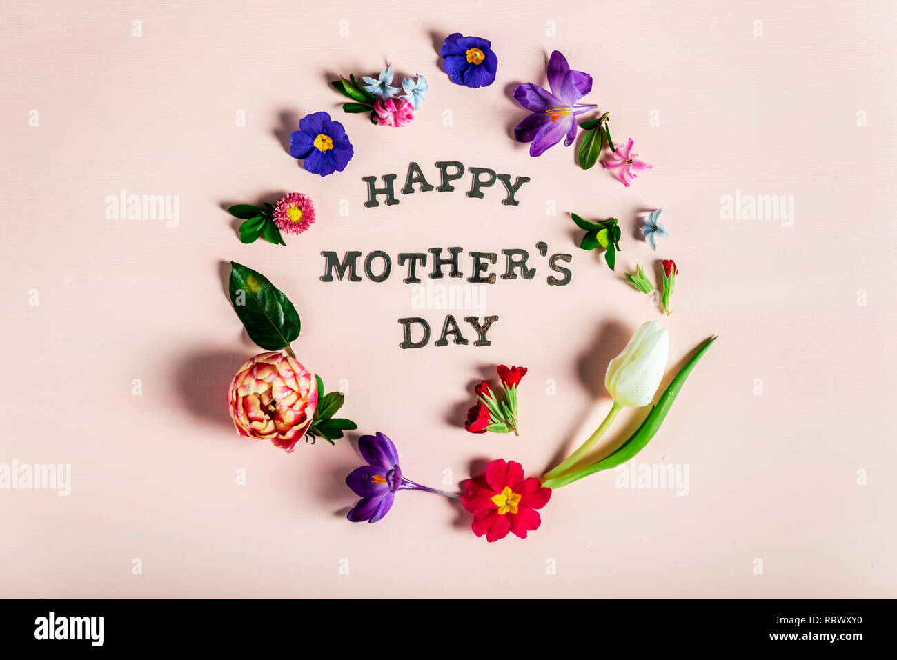 Happy Mothers Day letters with different spring flowers around them ...