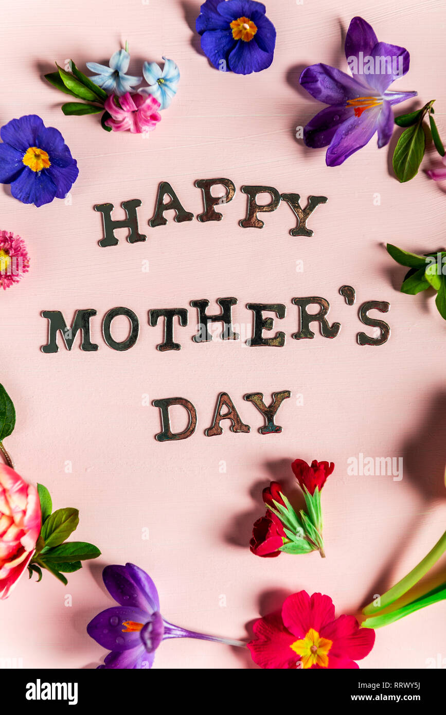 Happy Mothers Day letters with different spring flowers around them ...