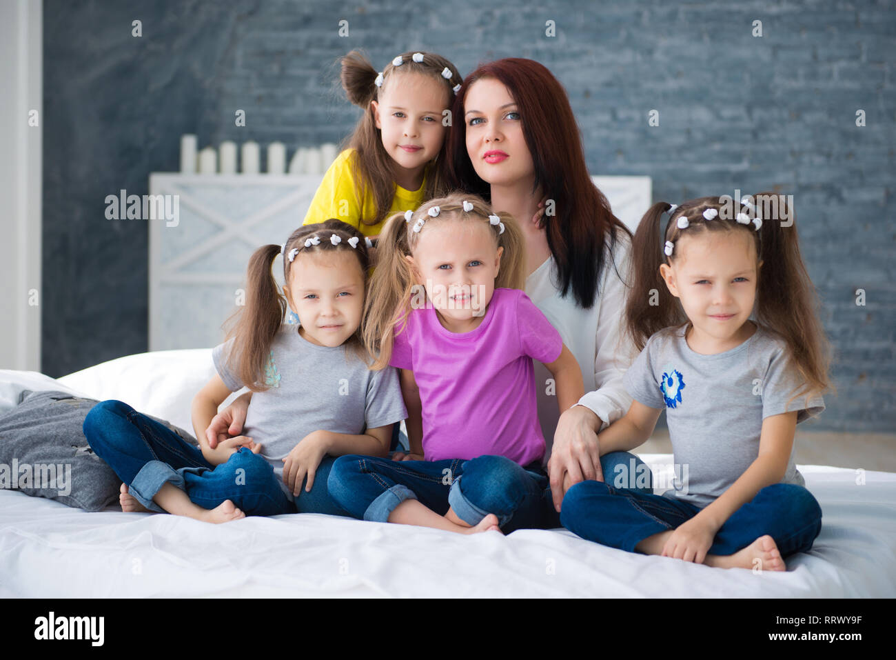 Large friendly family, many children: mom and four pretty cheerful ...