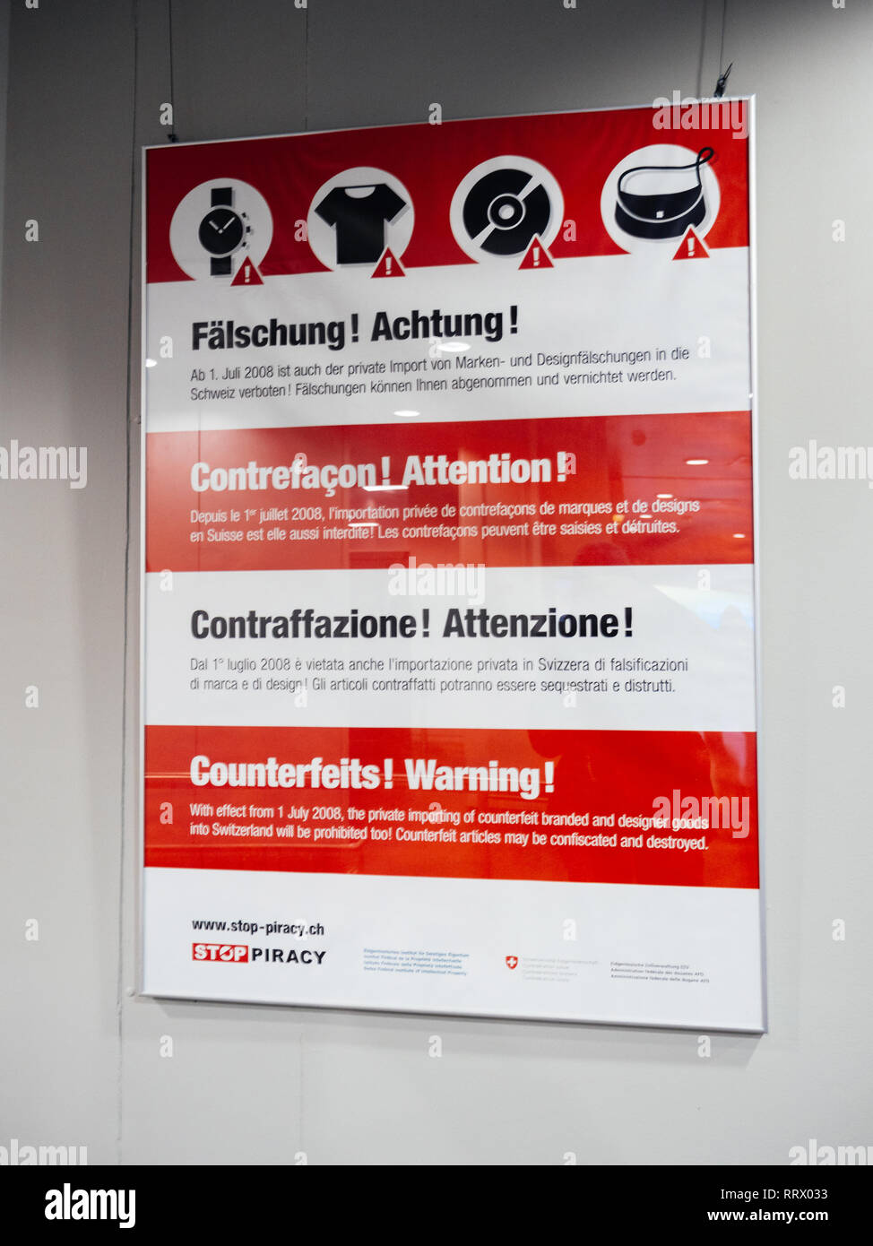 BASEL, SWITZERLAND - MAR 22, 2018: Counterfeits warning poster hanged ...