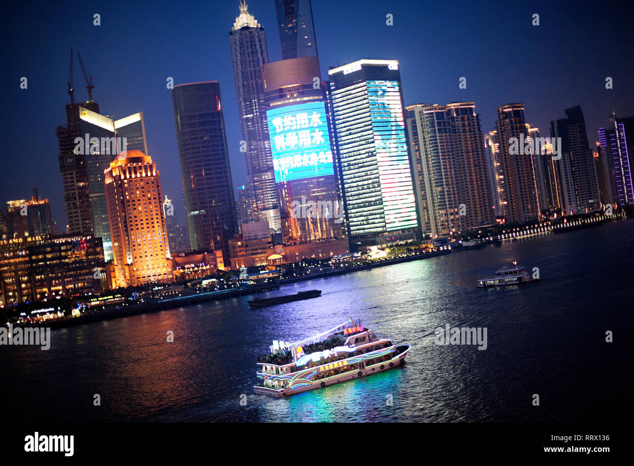 Urban waterfront illuminated at nighttime Stock Photo - Alamy