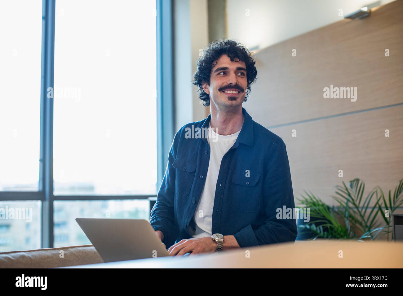 Over the shoulder man using laptop hi-res stock photography and images ...