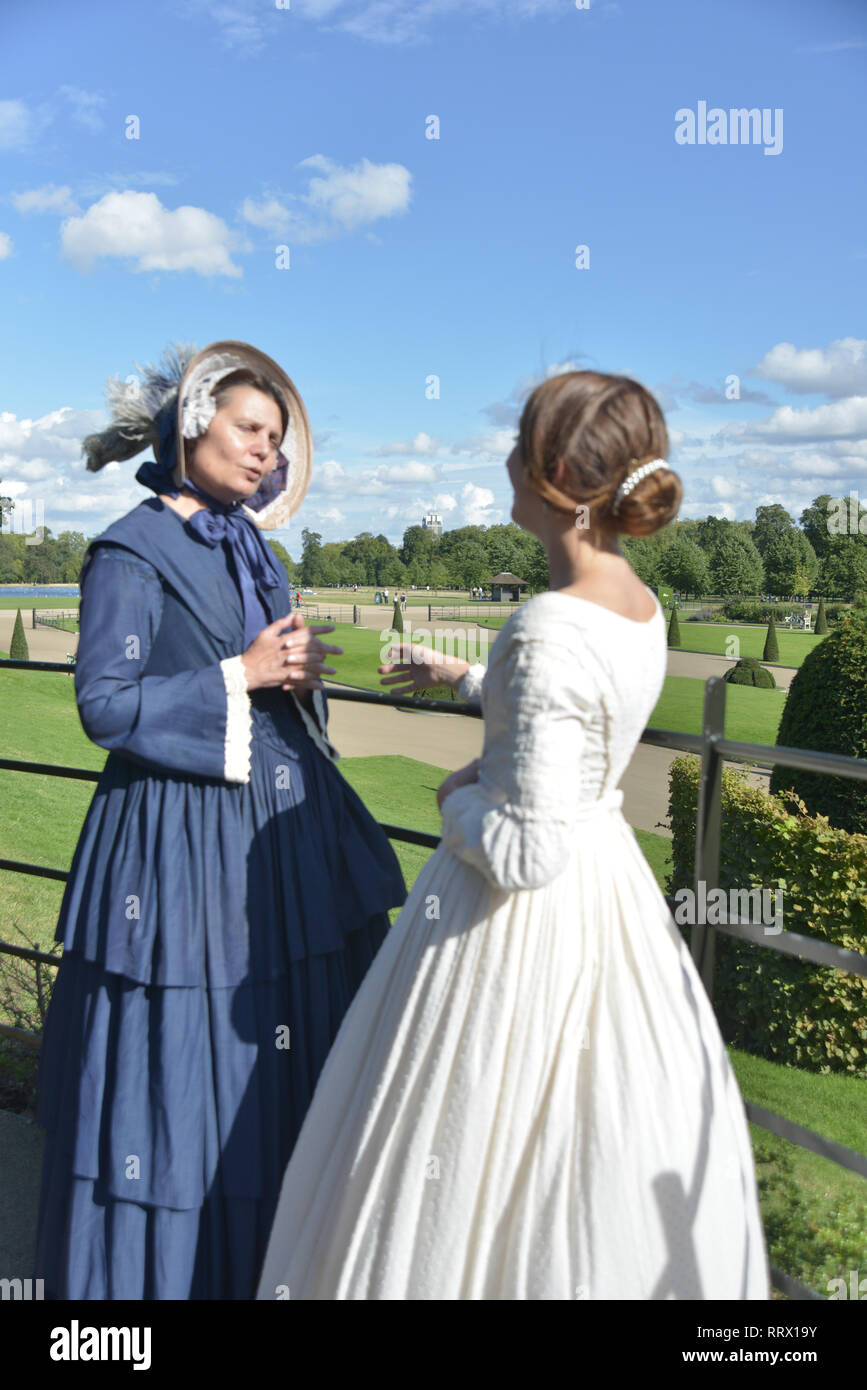 Two modern day women in historically accurate Victorian dress walk ...