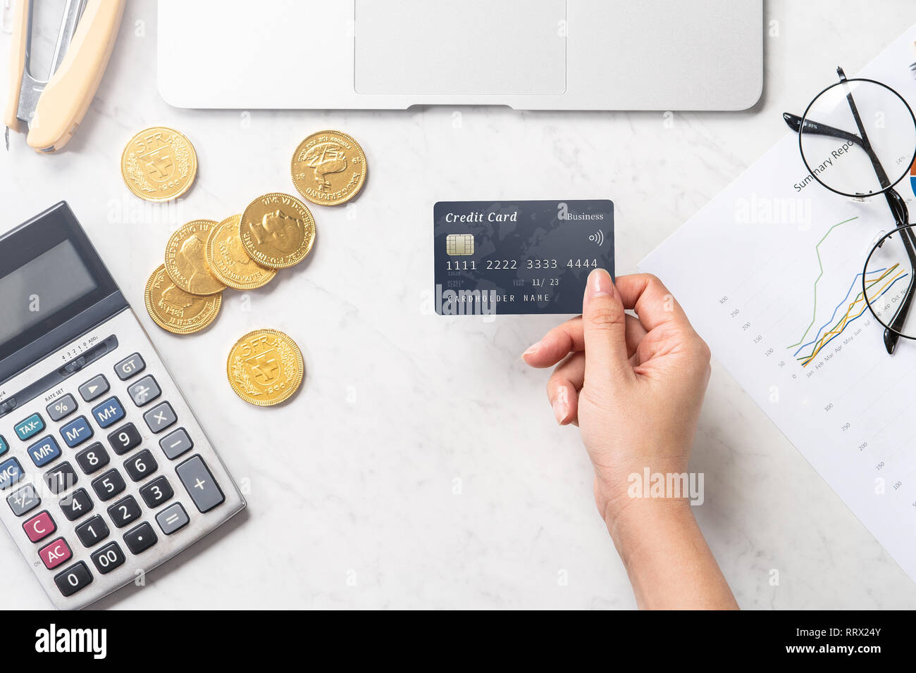 concept of a woman doing online payment with card and smartphone ...