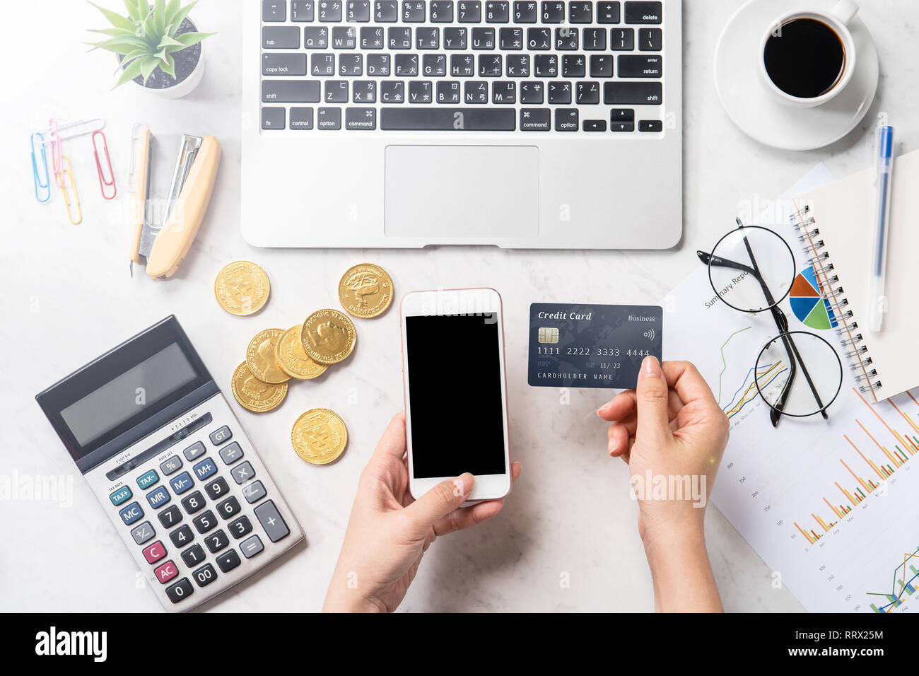 concept of a woman doing online payment with card and smartphone ...
