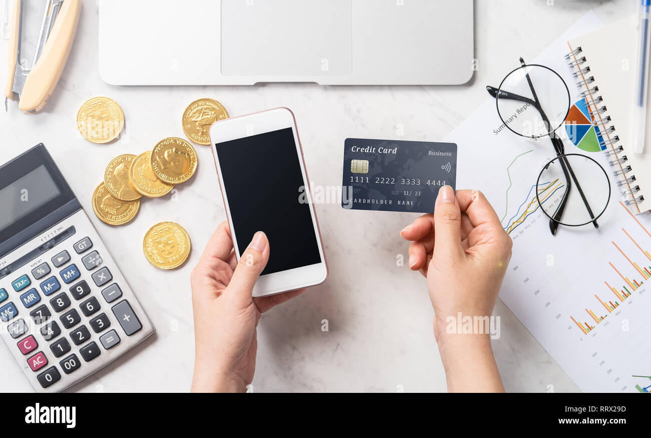 concept of a woman doing online payment with card and smartphone ...