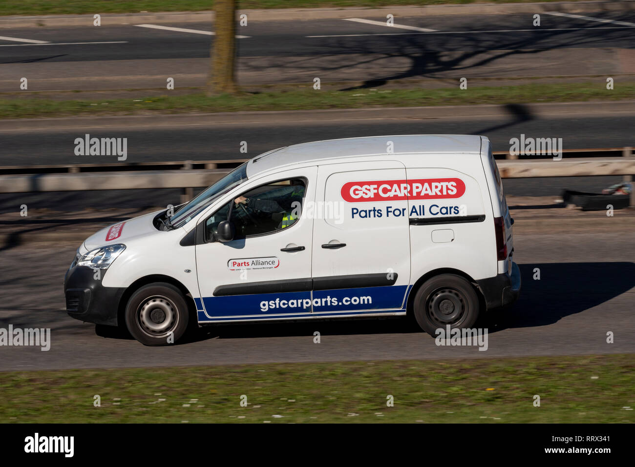GSF Car Parts delivery van driving on the road. Parts Alliance white ...