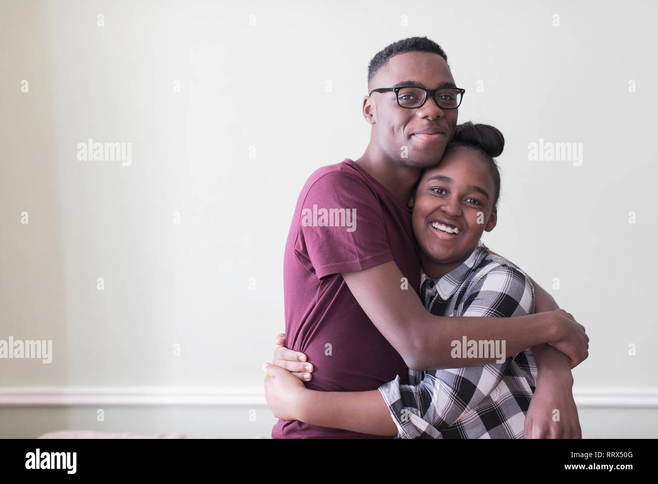 Portrait affectionate teenage brother and sister hugging Stock Photo ...