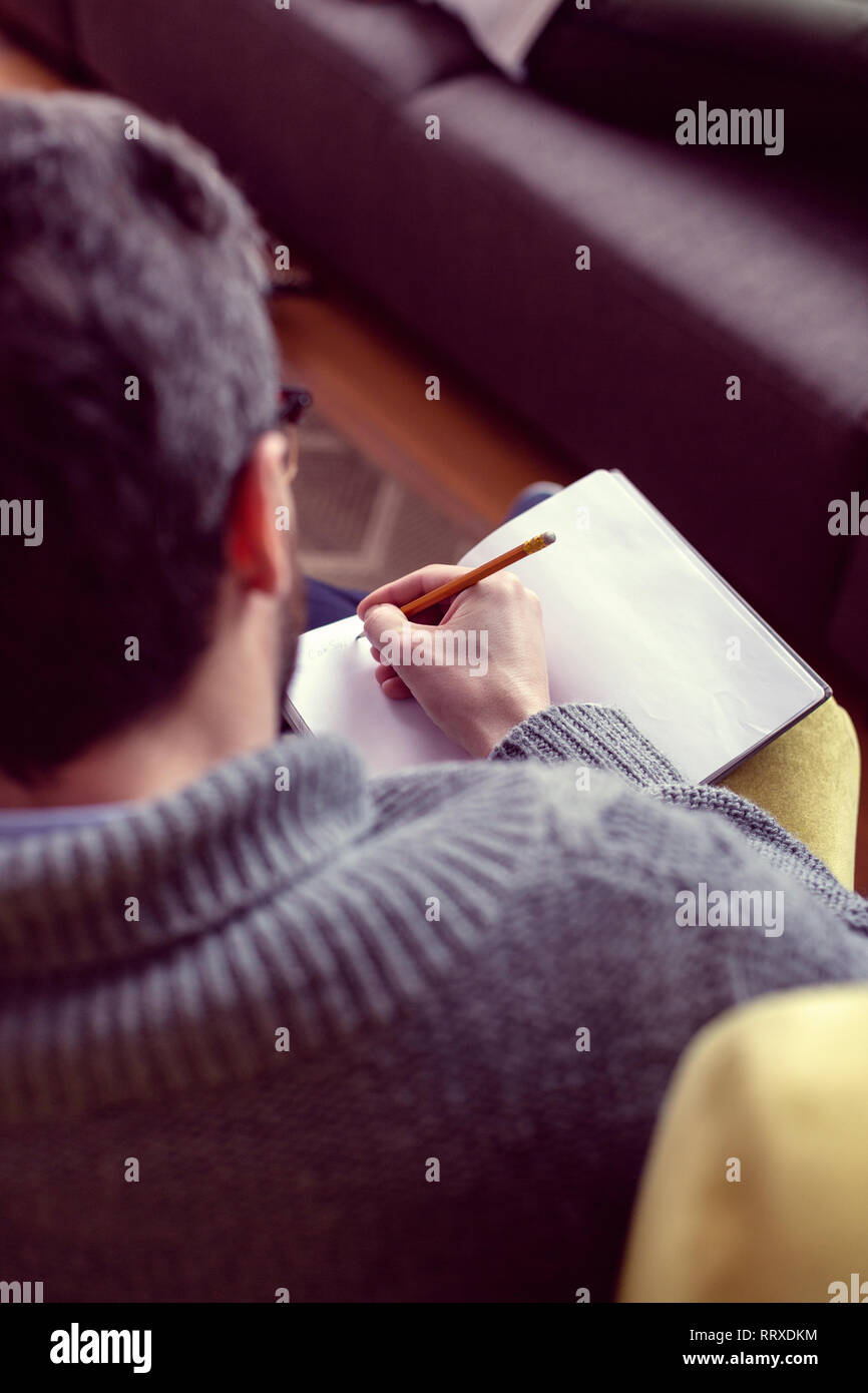 Top view of a nice handsome man taking notes Stock Photo - Alamy