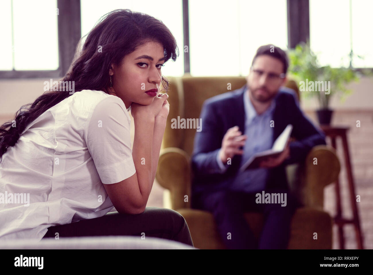 Sad unhappy young woman looking at you Stock Photo - Alamy