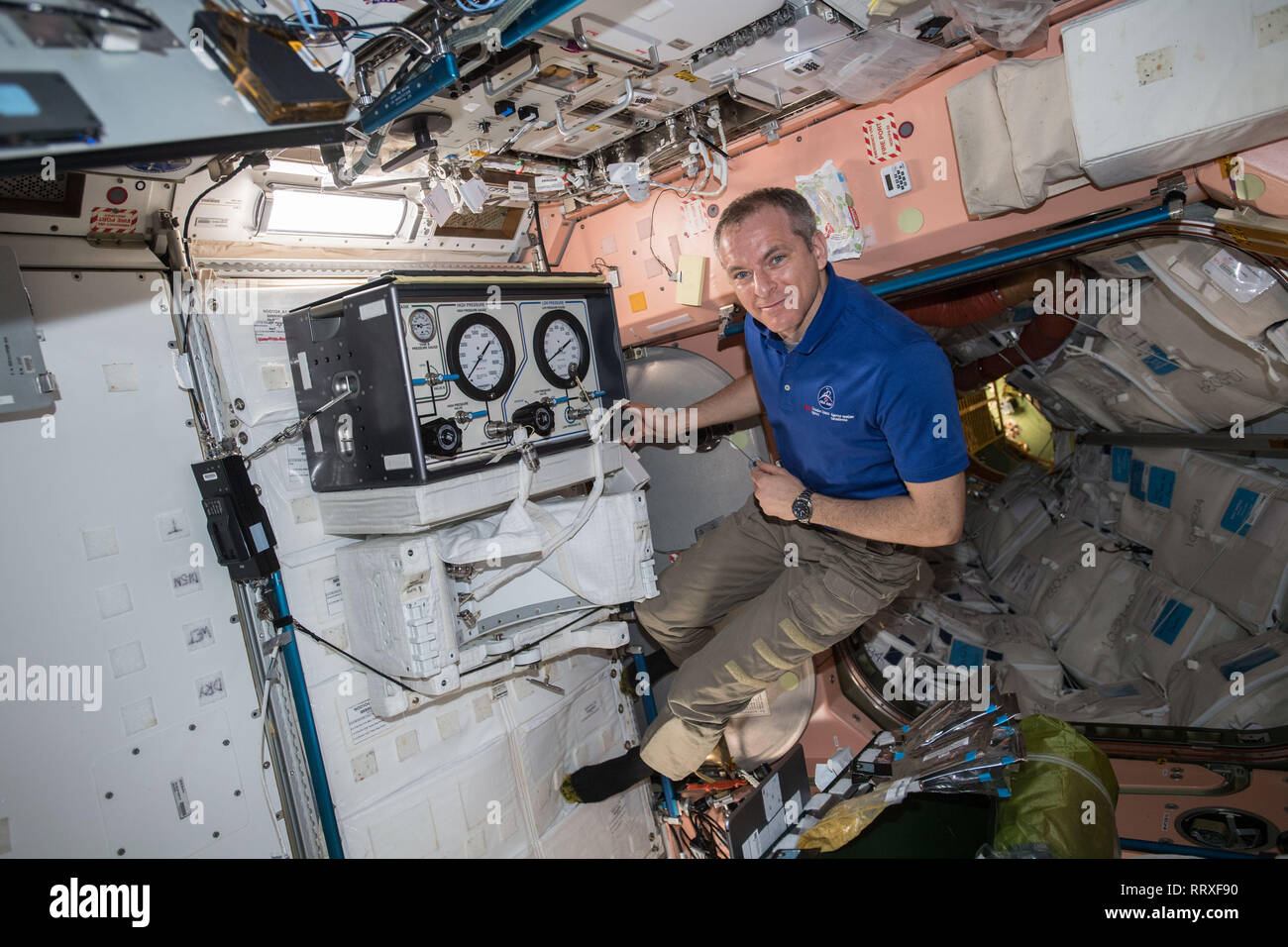 Canadian Space Agency astronaut David Saint-Jacques works inside the ...