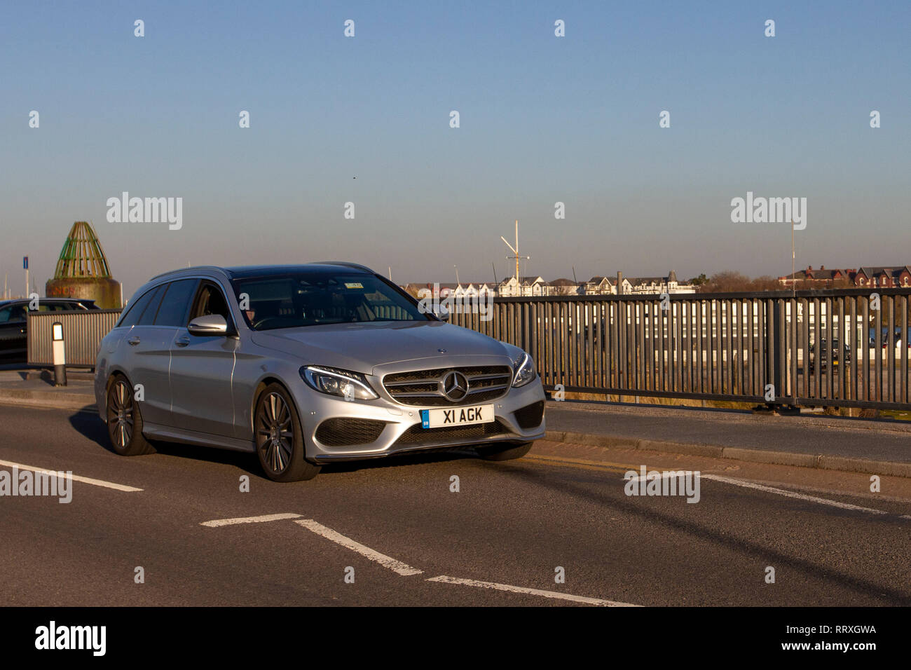 2017 silver Mercedes-Benz C220 D AMG Line Premium A being driven on Southport seafront promenade ...