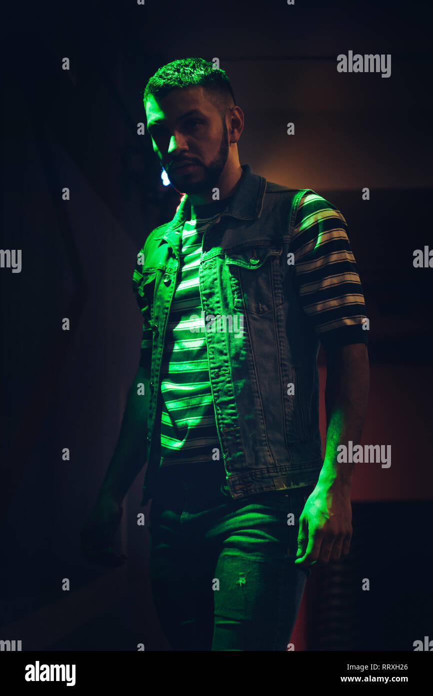 Handsome bearded man dancing in spotlight Stock Photo - Alamy